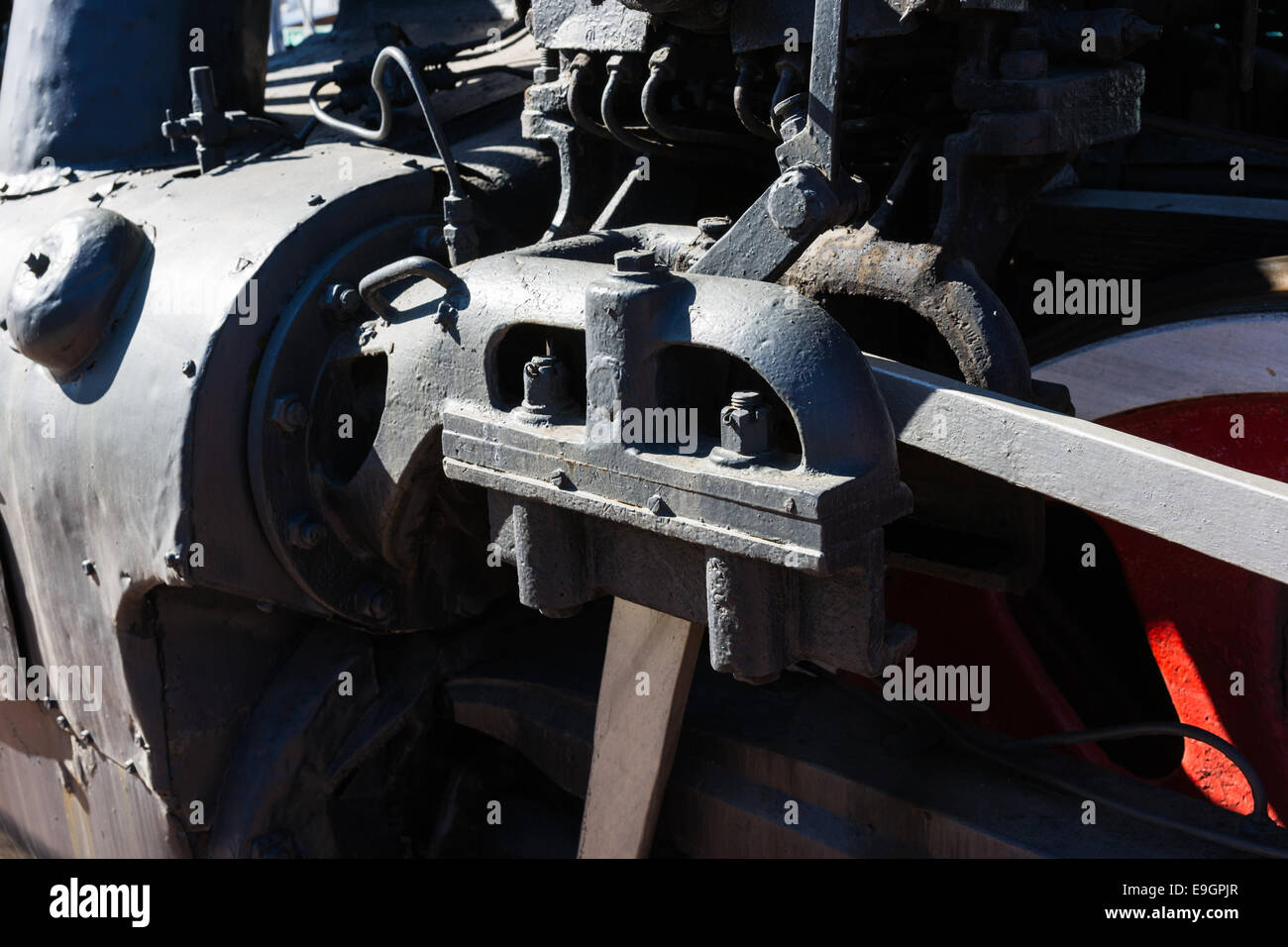 View of the piston mechanism of an old steam locomotive. Black metal ...