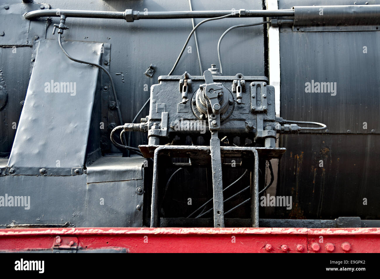 Closeup view of a mechanical equipment around a steam locomotive boiler ...
