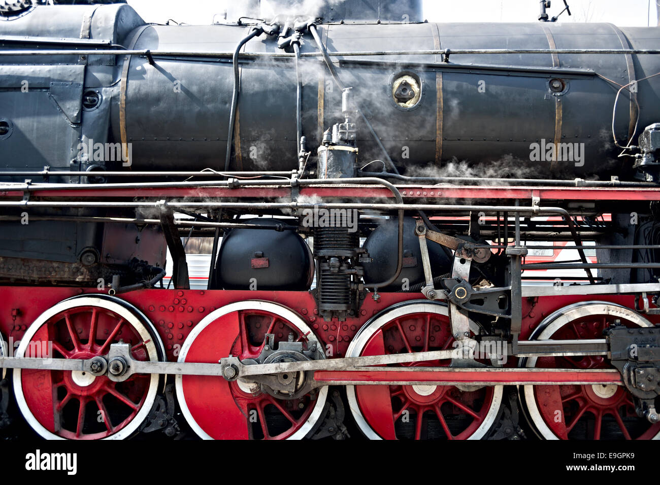 Steam locomotive in steam and ready to depart. Live hot steam around ...