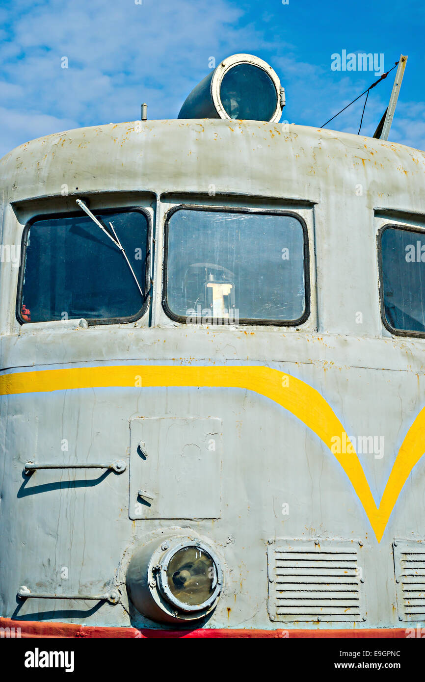 Closeup frontal view of an old diesel locomotive against the background ...