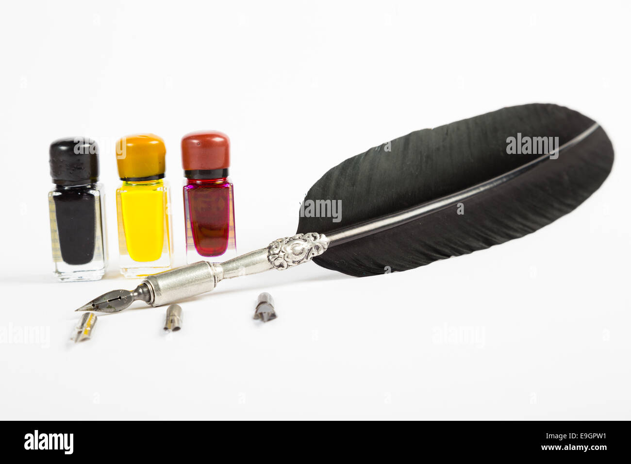 Feather quill isolated on white with ink well´s Stock Photo - Alamy