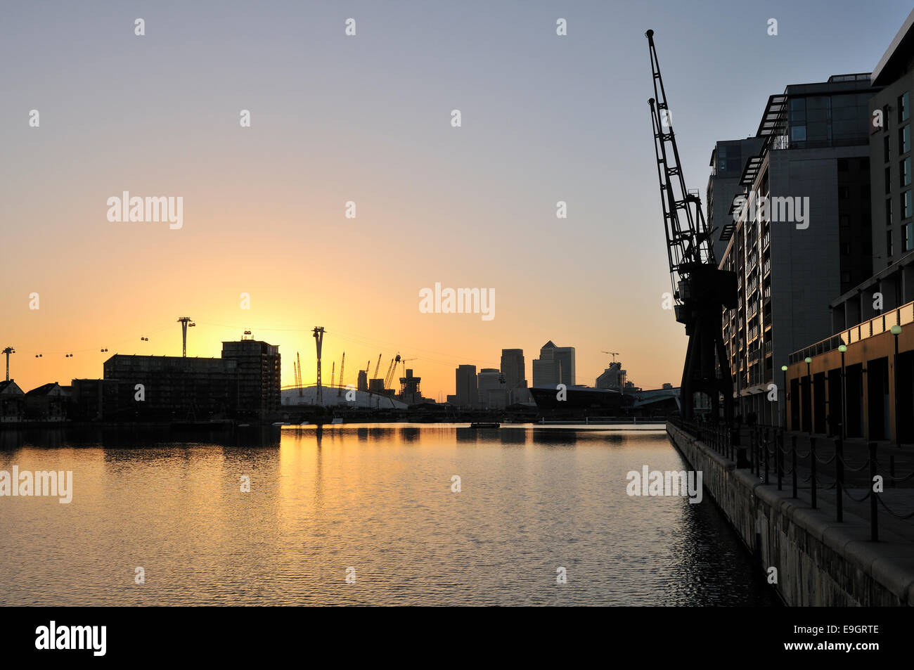 Royal Victoria Dock in Docklands, East London UK, at dusk, with the sun ...