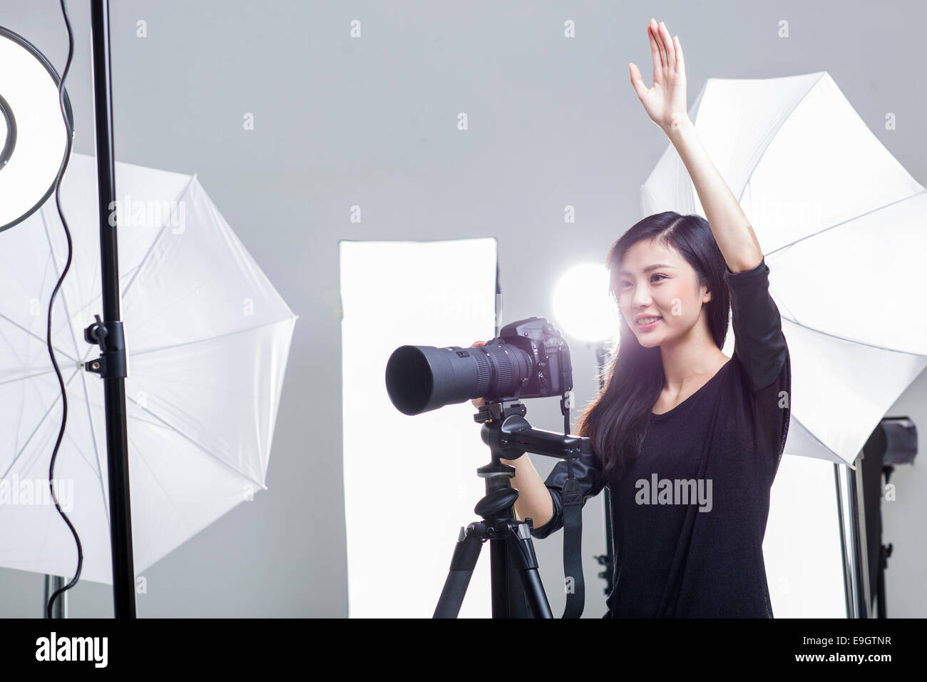 Photographer taking picture in studio Stock Photo - Alamy