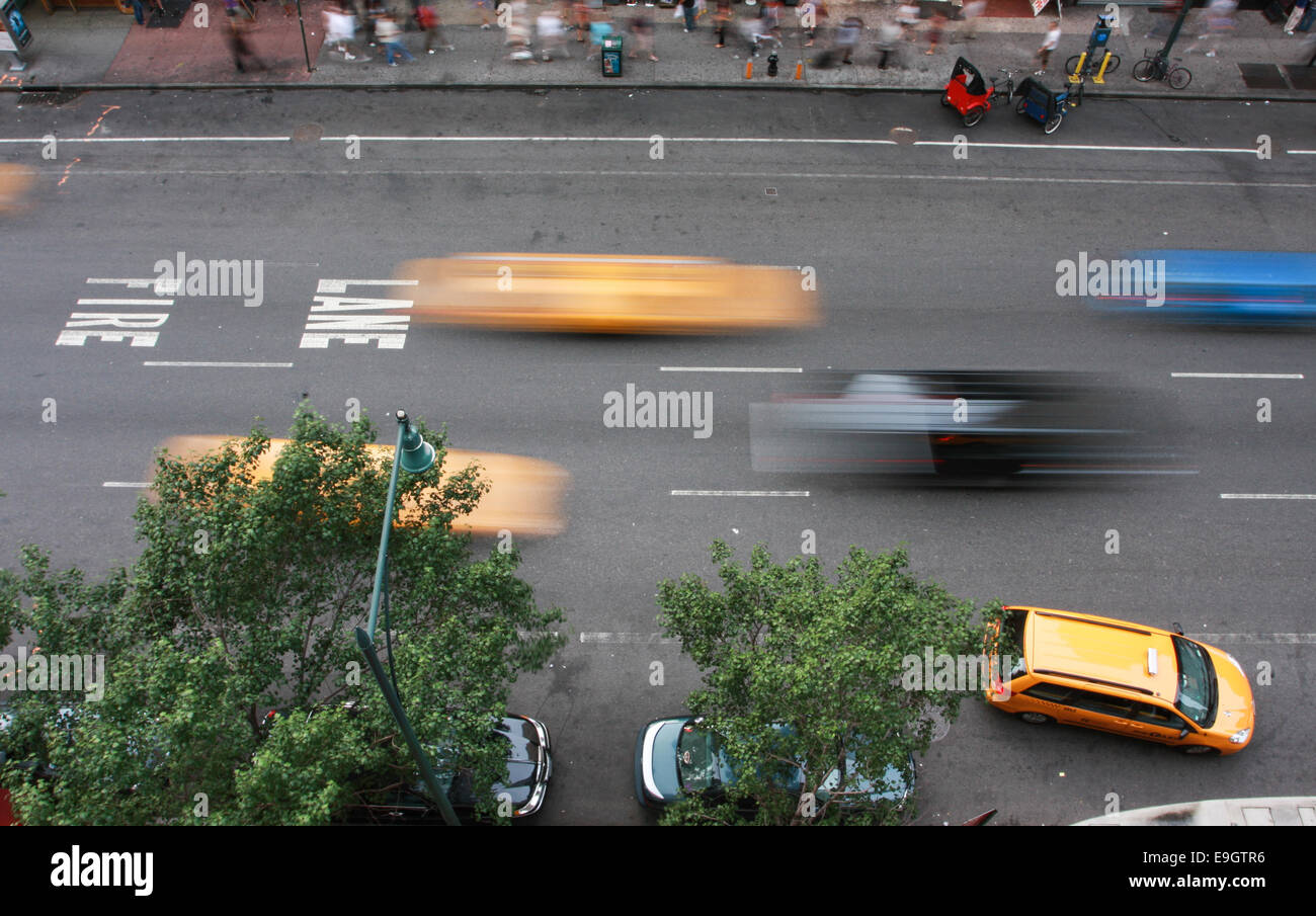 Blurry cars driving past on street Stock Photo - Alamy
