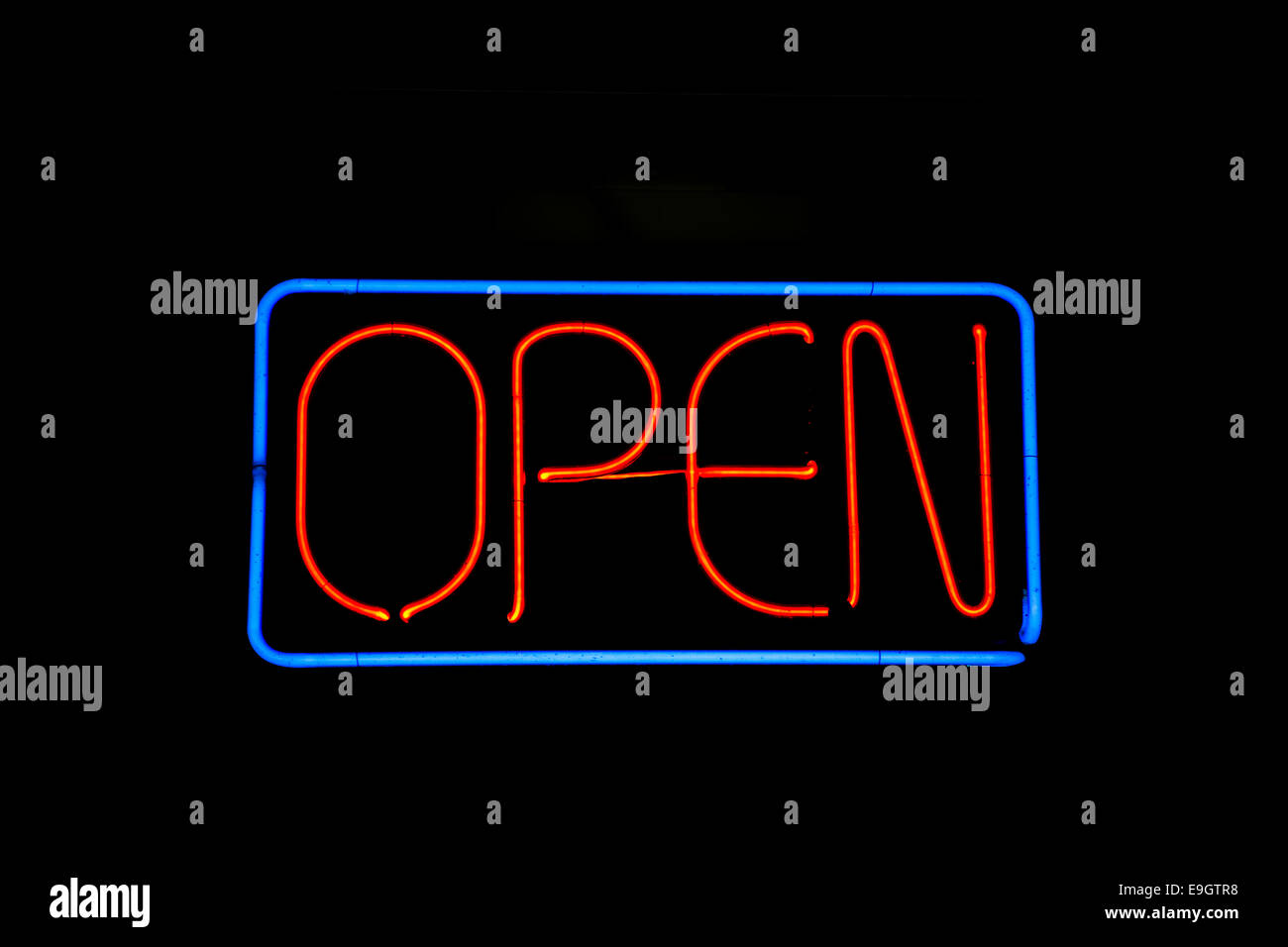Neon sign reading open on black Stock Photo - Alamy