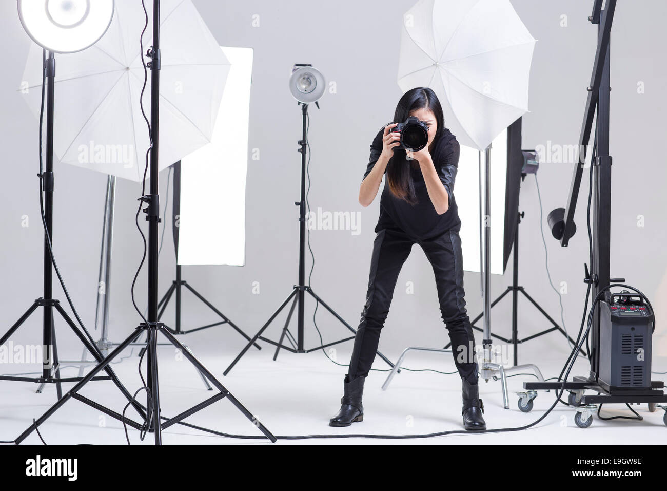 Photographer taking picture in studio Stock Photo - Alamy