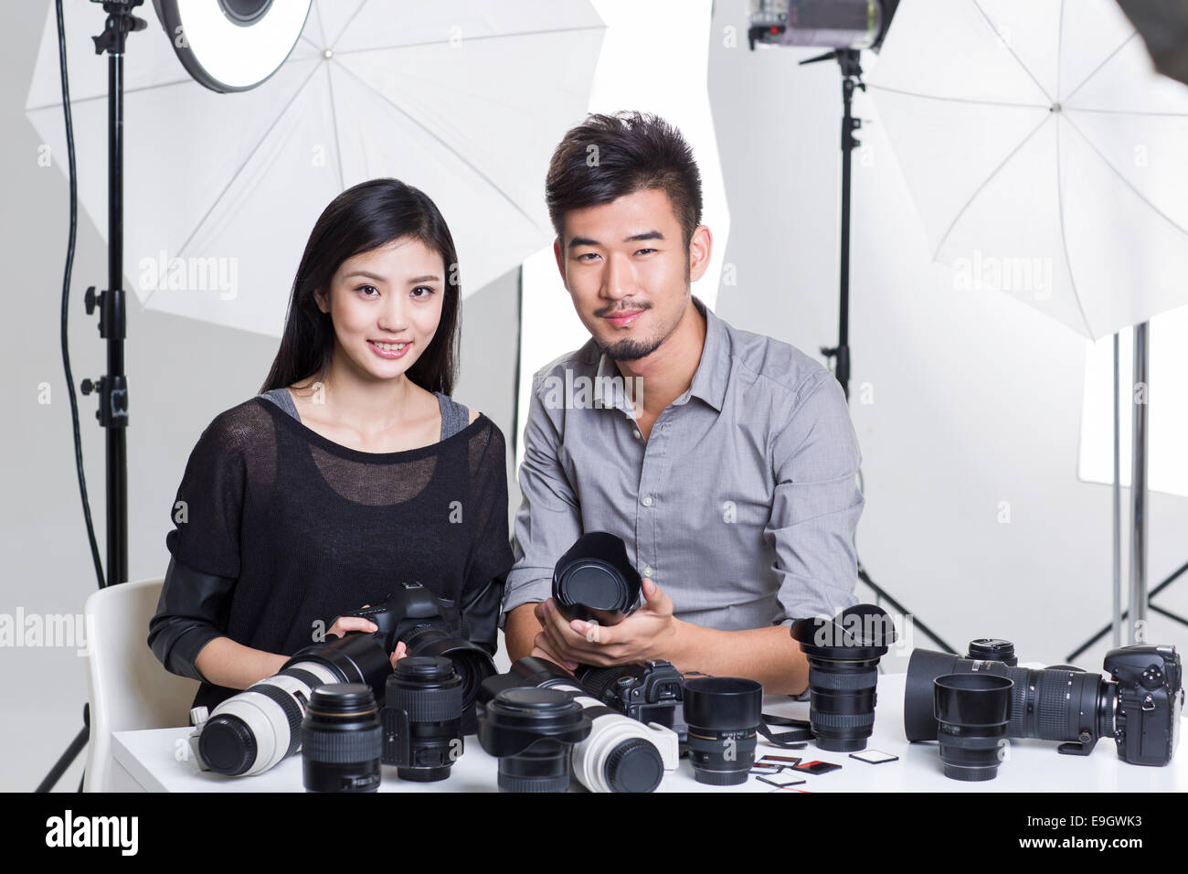 Portrait of two photographers in studio Stock Photo - Alamy