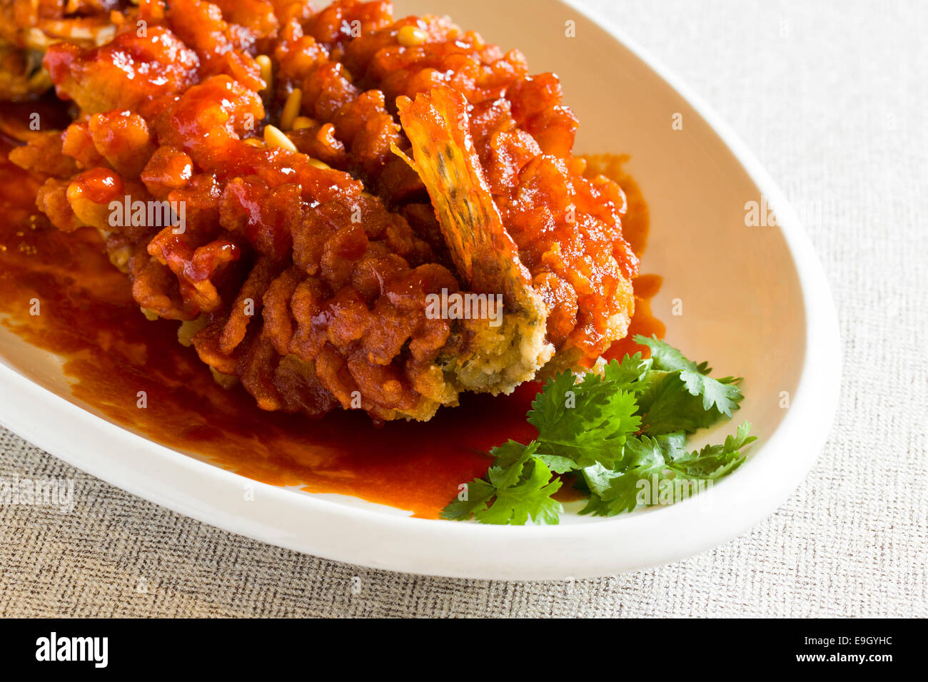 Chinese cuisine fish with pine nuts Stock Photo - Alamy