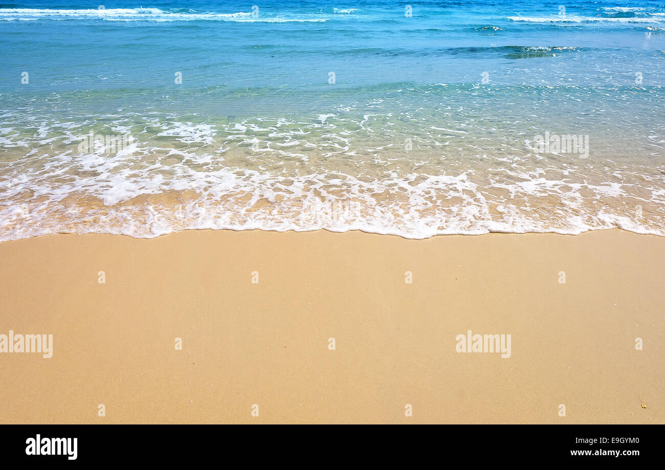 Wave of the sea on the sand beach Stock Photo - Alamy
