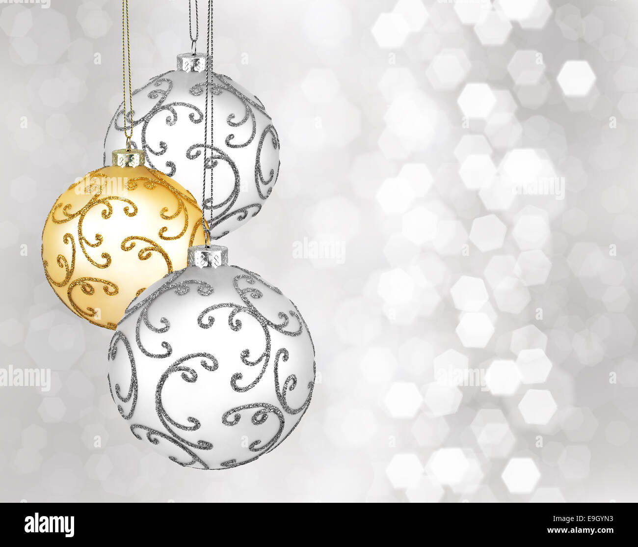Three beautiful christmas balls on a silver background Stock Photo - Alamy