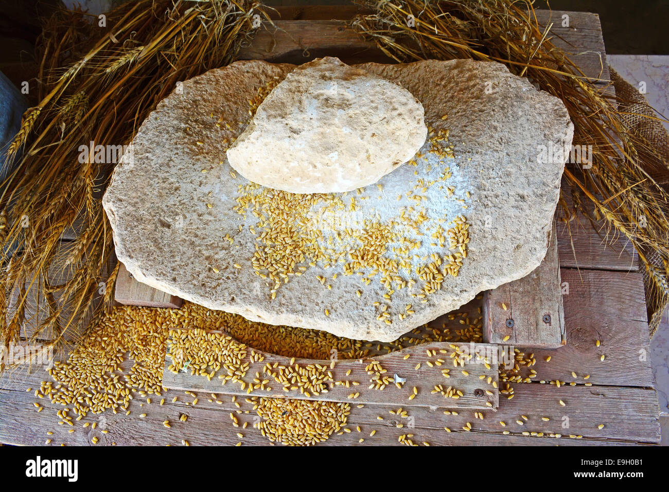 Wheat stone grinder Stock Photo - Alamy