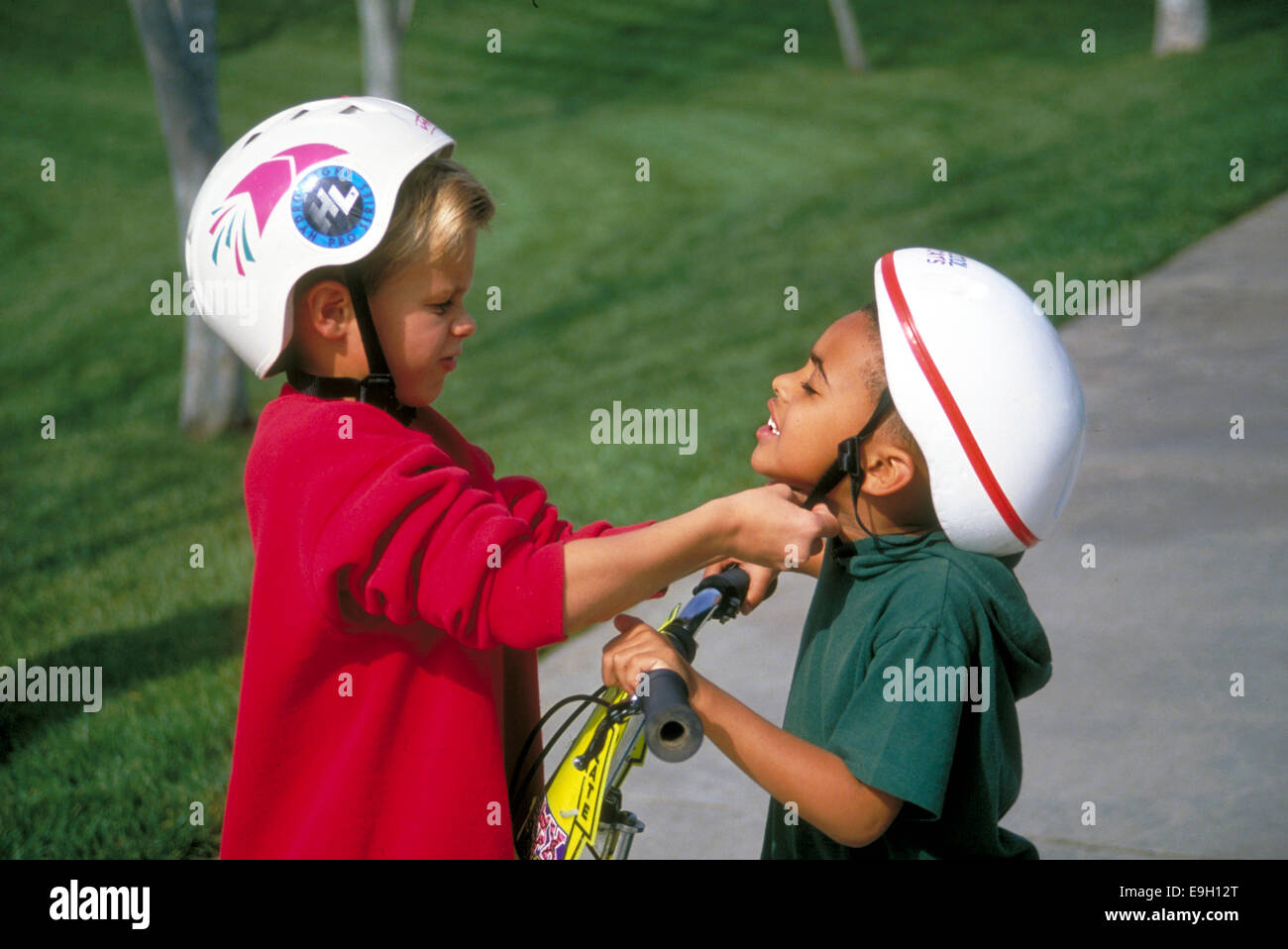 Child Helping Another Child High Resolution Stock Photography and ...