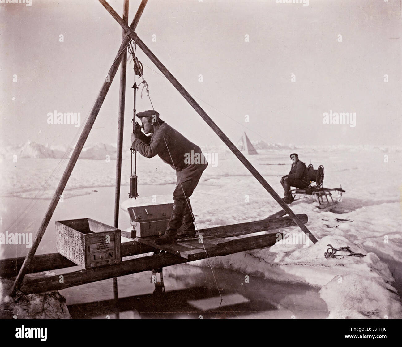 A photograph of Fridtjof Nansen reading the temperature from a water ...