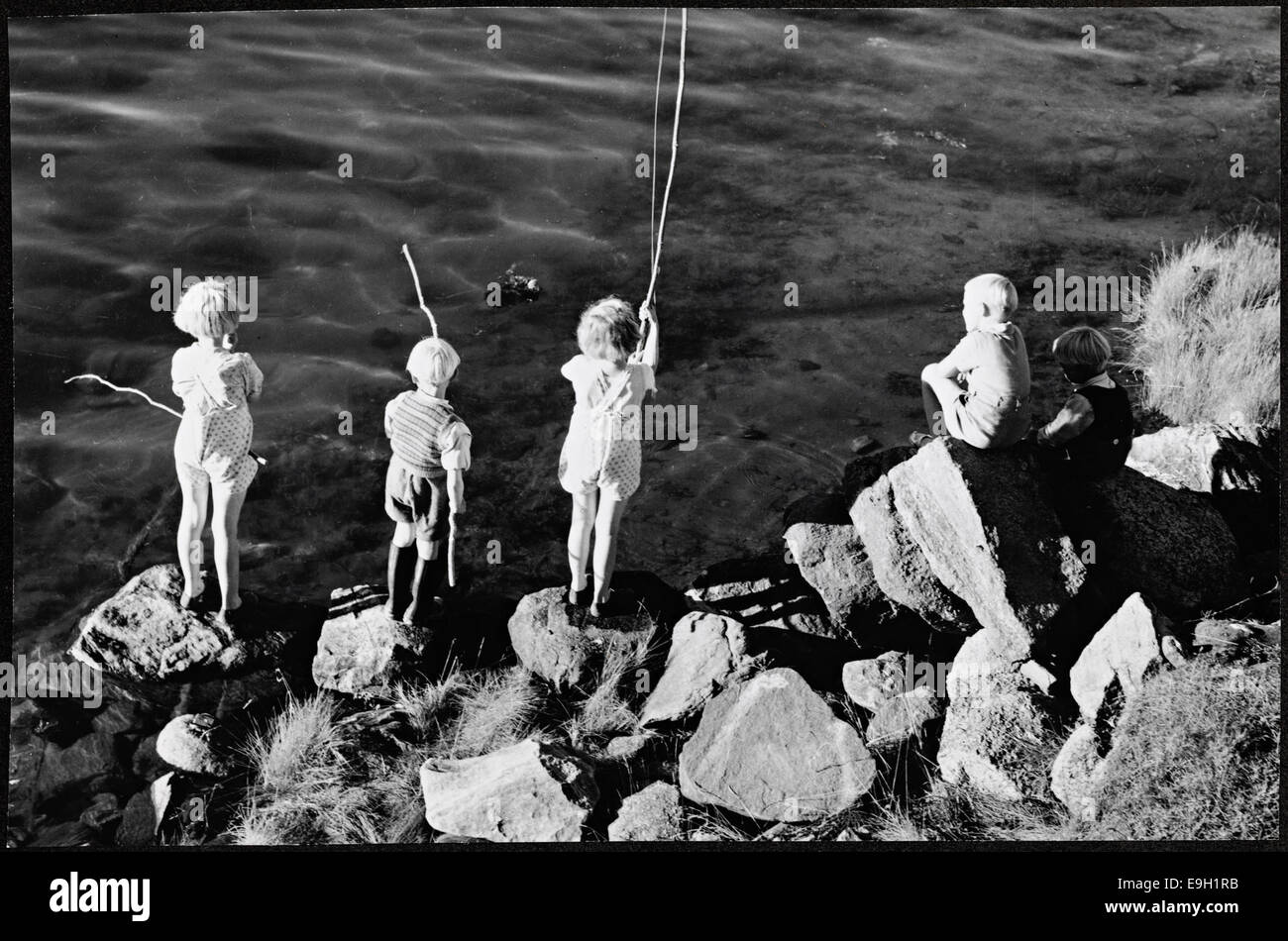 A photograph of children fishing during summer vacation, taken in the ...