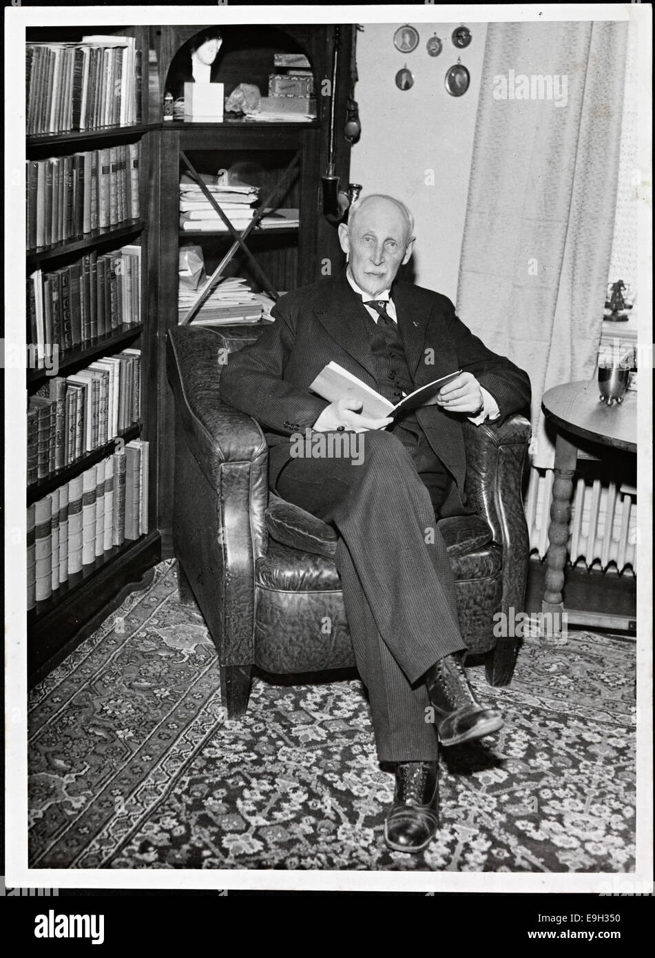 A portrait of businessman Theodor Bull in his library. The photograph ...