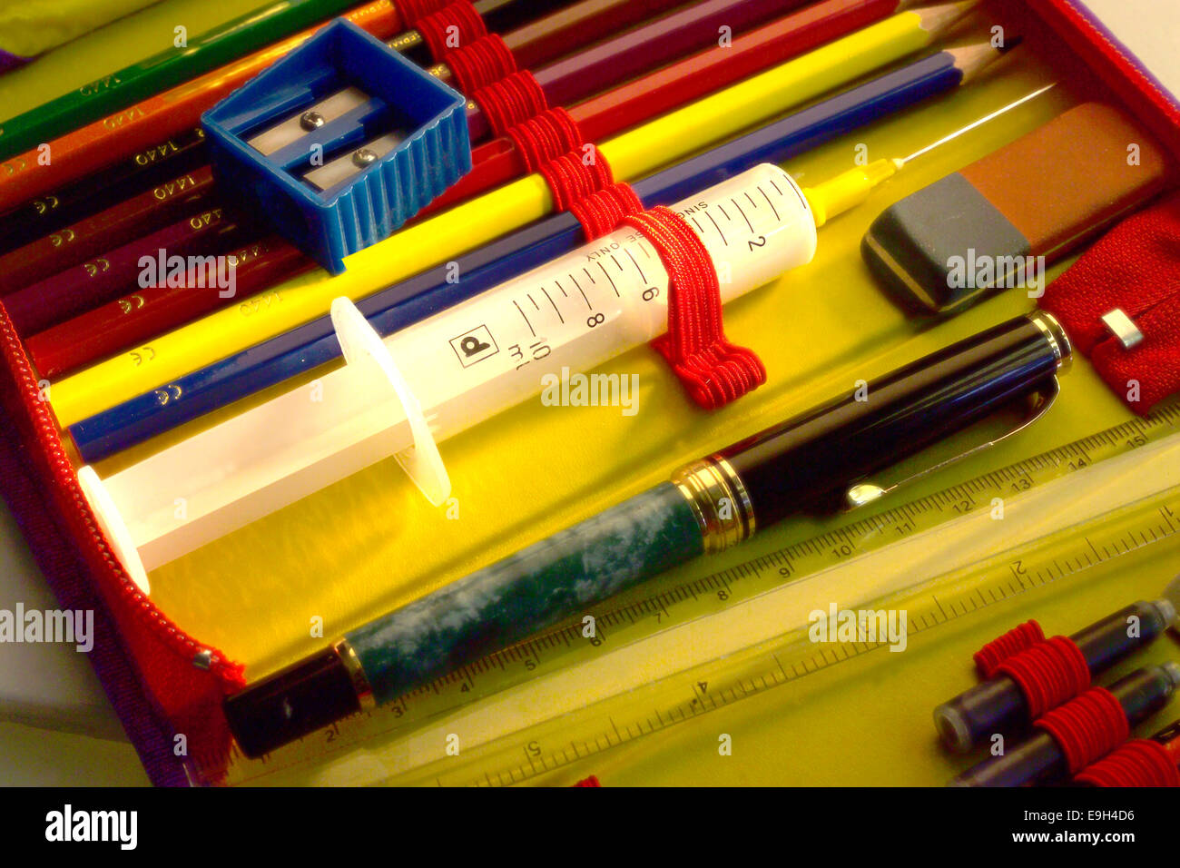 A medical syringe in a pencil case Stock Photo - Alamy