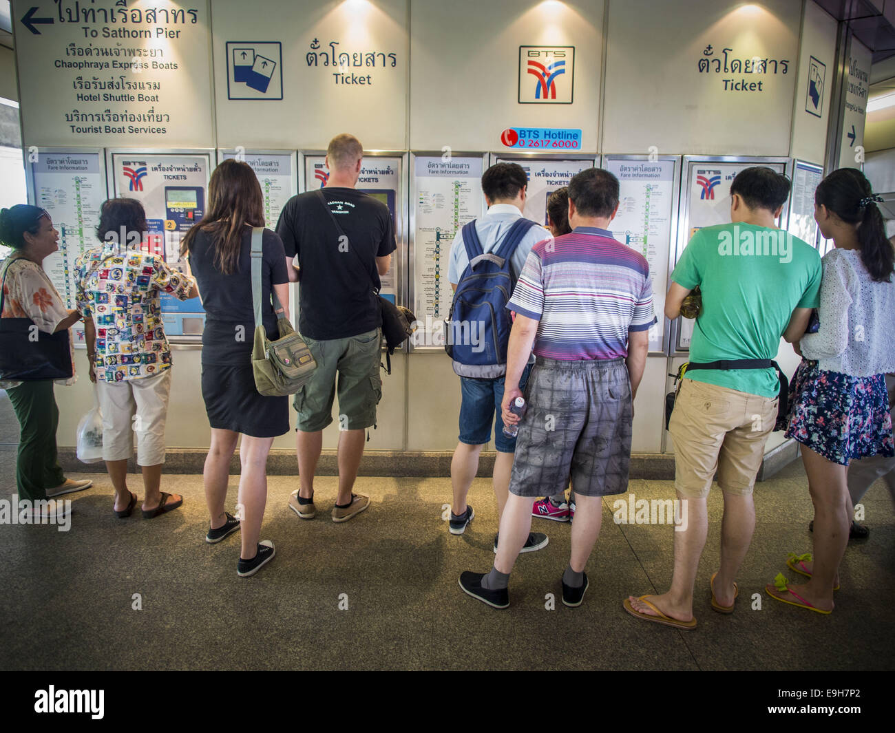 Bangkok, Thailand. 28th Oct, 2014. Passengers line up at the ticket ...