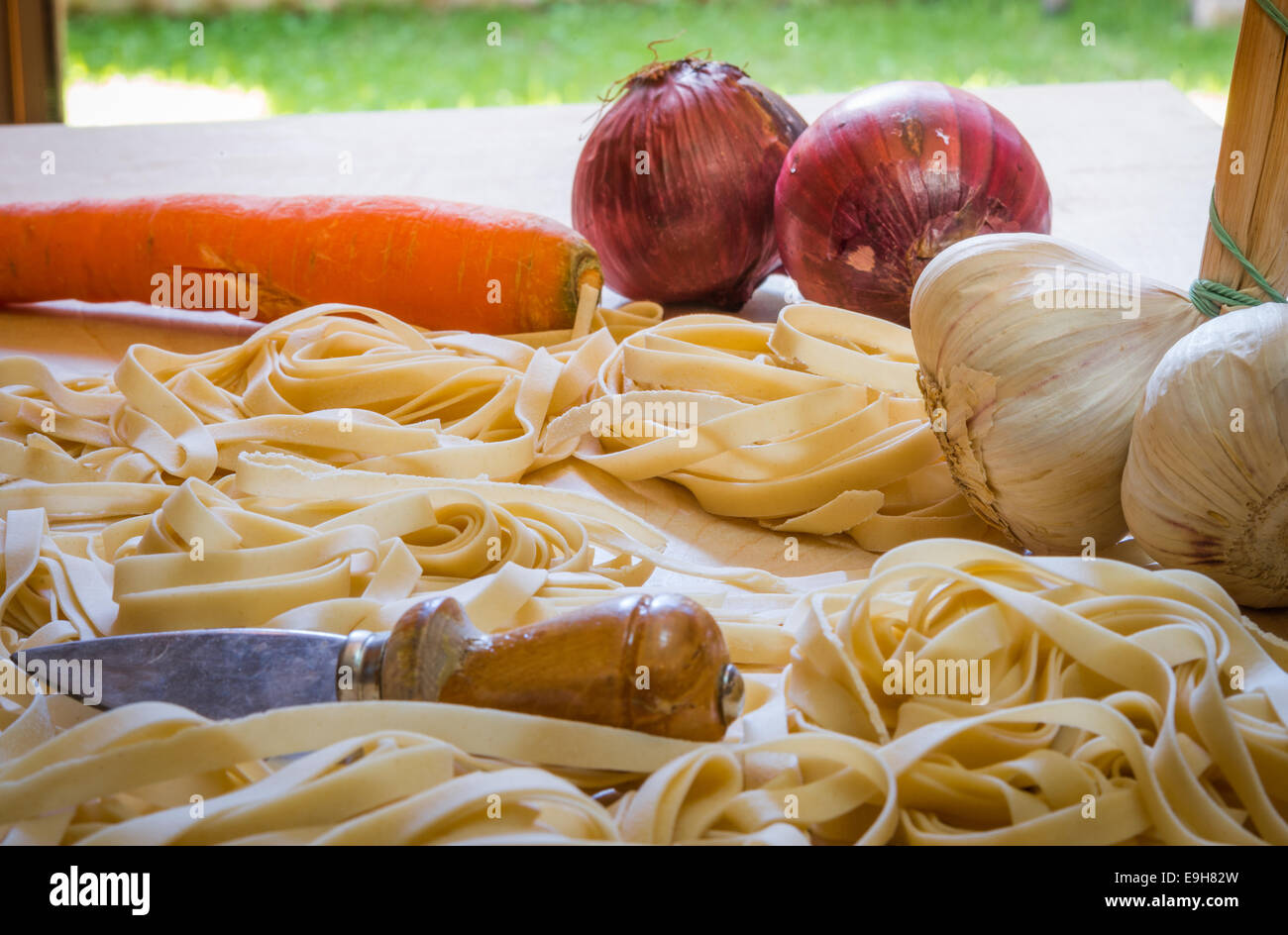 Fettuccine or tagliatelle cut ready to cook with vegetables Stock Photo ...