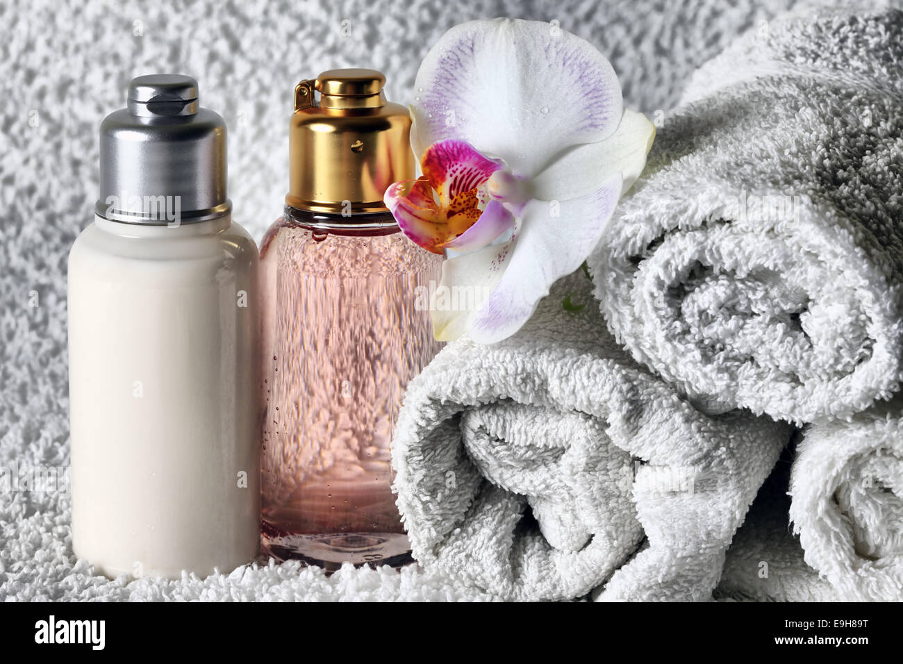 Body care products and a beautiful orchid Stock Photo - Alamy