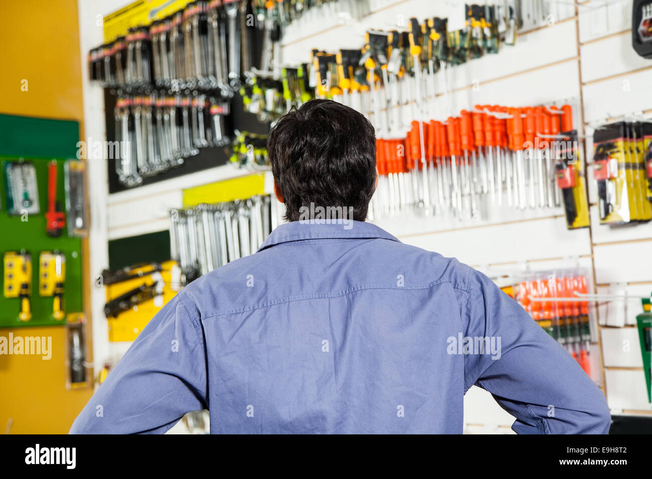 Rear View Of Customer In Hardware Shop Stock Photo - Alamy