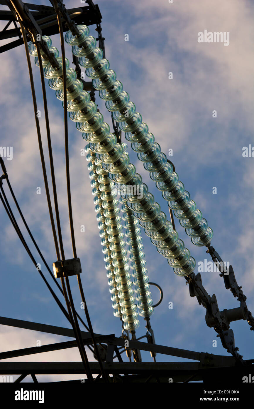 Power lines glass insulators on electricity pylons Stock Photo - Alamy