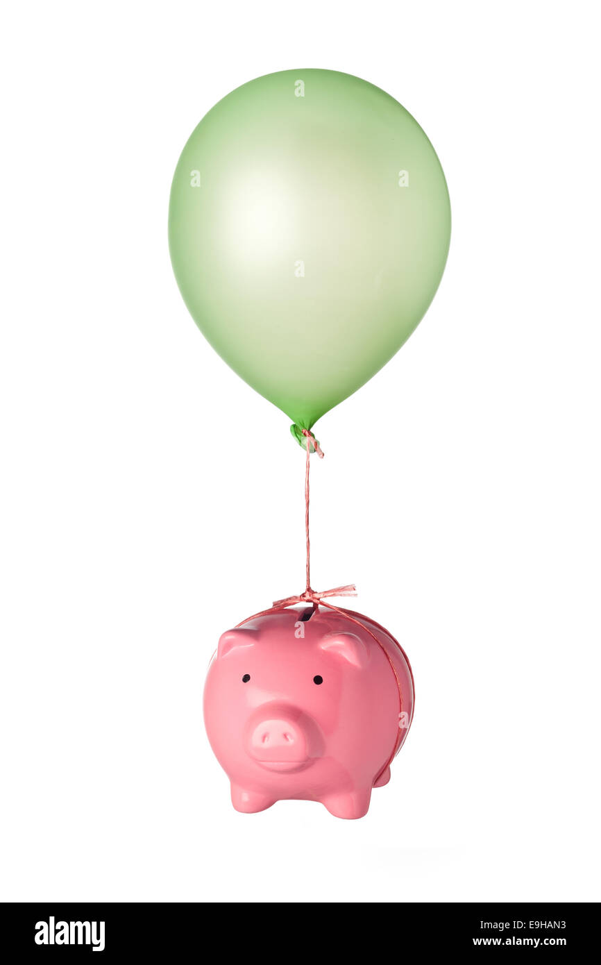 Piggy bank tied to floating balloon isolated on white background Stock ...
