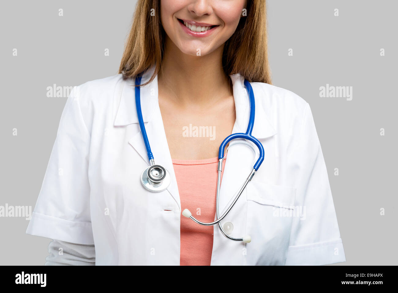 Beautiful and attractive female doctor, isolated over a white ...