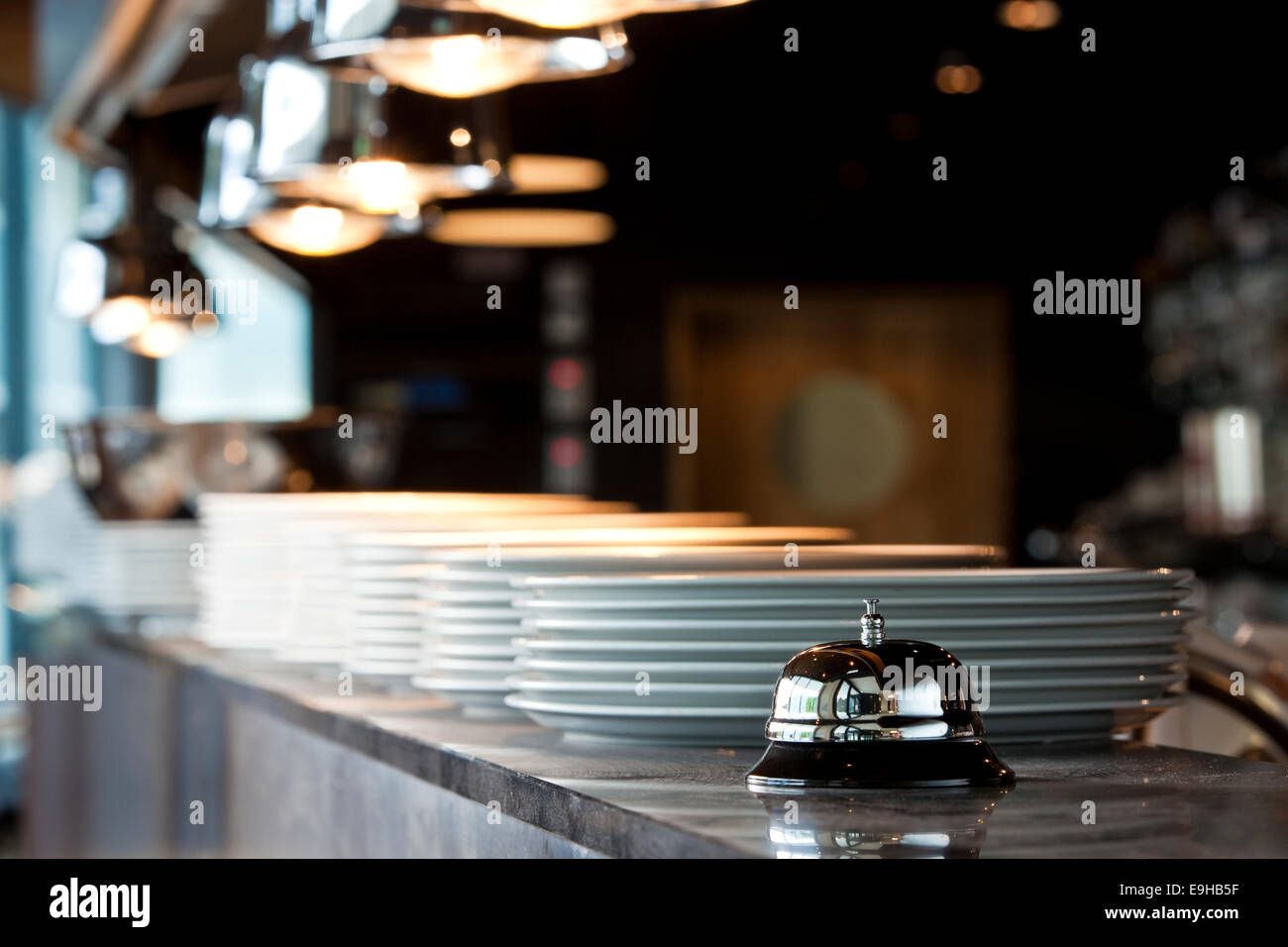 Bell on the food counter of a restaurant Stock Photo - Alamy