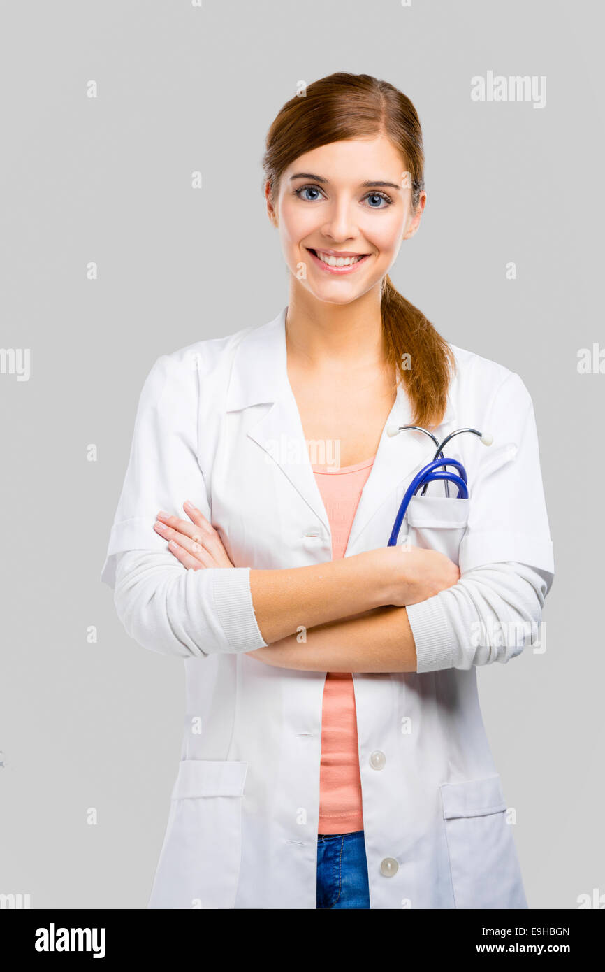 Beautiful and attractive female doctor, isolated over a white ...