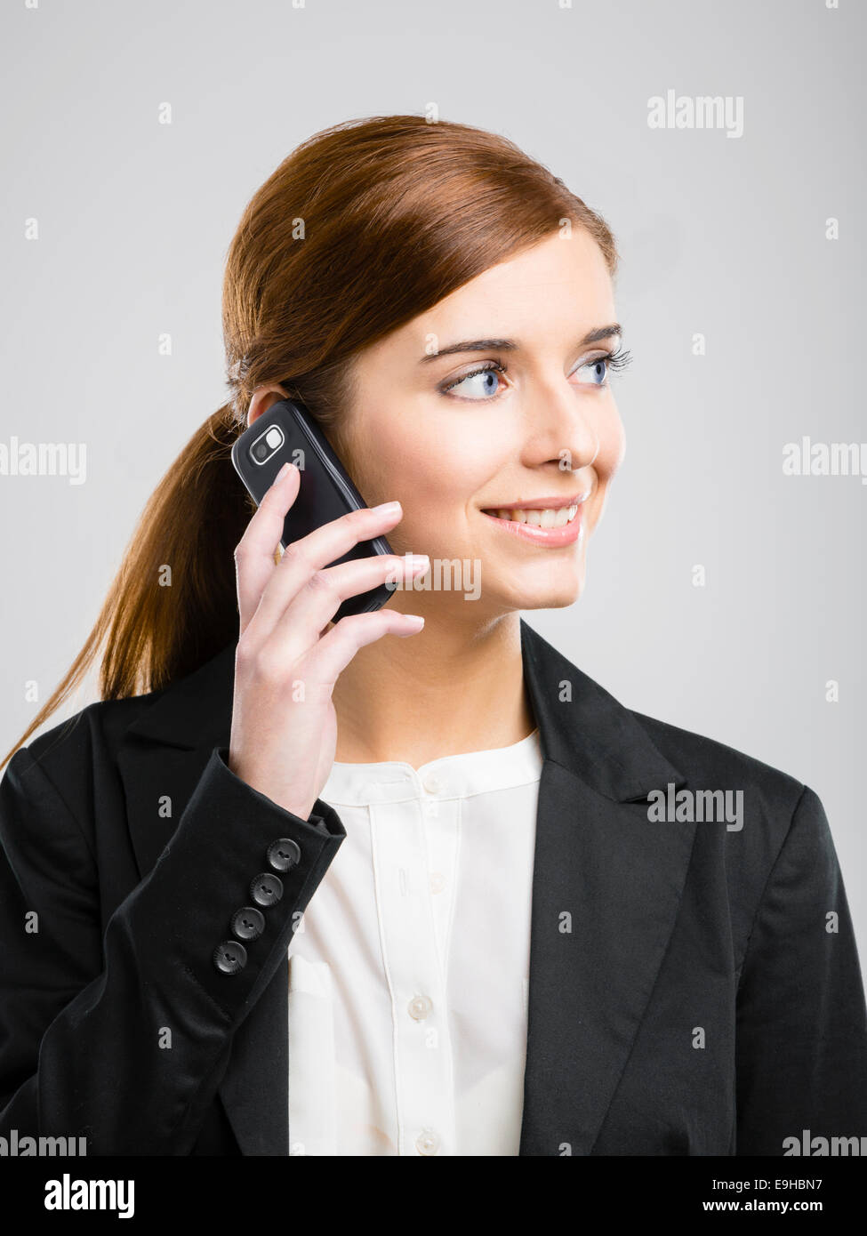 Beautiful business woman making a phone call Stock Photo - Alamy