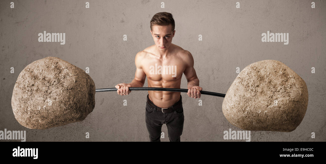 muscular man lifting large rock stone weights Stock Photo - Alamy
