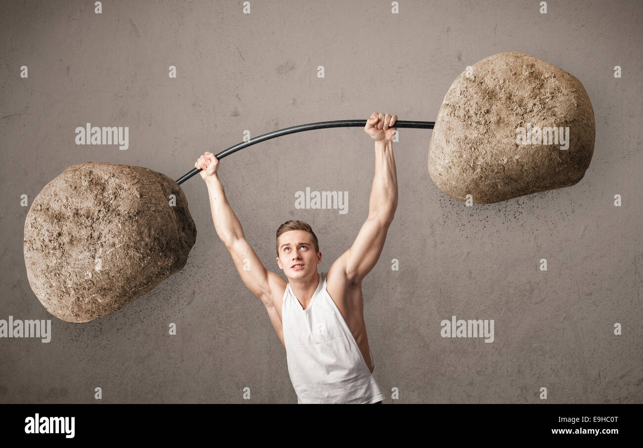 muscular man lifting large rock stone weights Stock Photo - Alamy