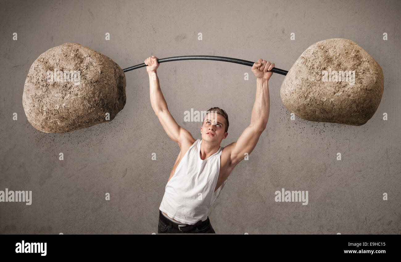 muscular man lifting large rock stone weights Stock Photo - Alamy