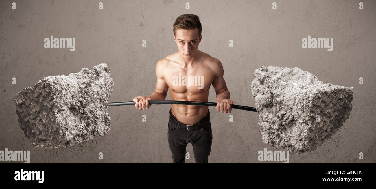 muscular man lifting large rock stone weights Stock Photo - Alamy