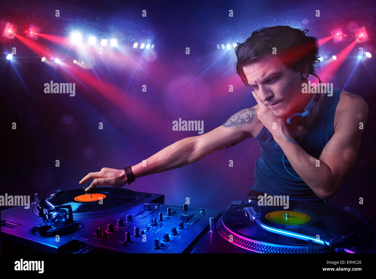 Teenager dj mixing records in front of a crowd on stage Stock Photo - Alamy