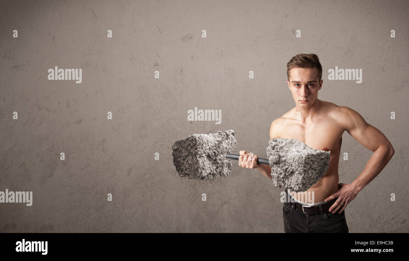muscular man lifting large rock stone weights Stock Photo - Alamy