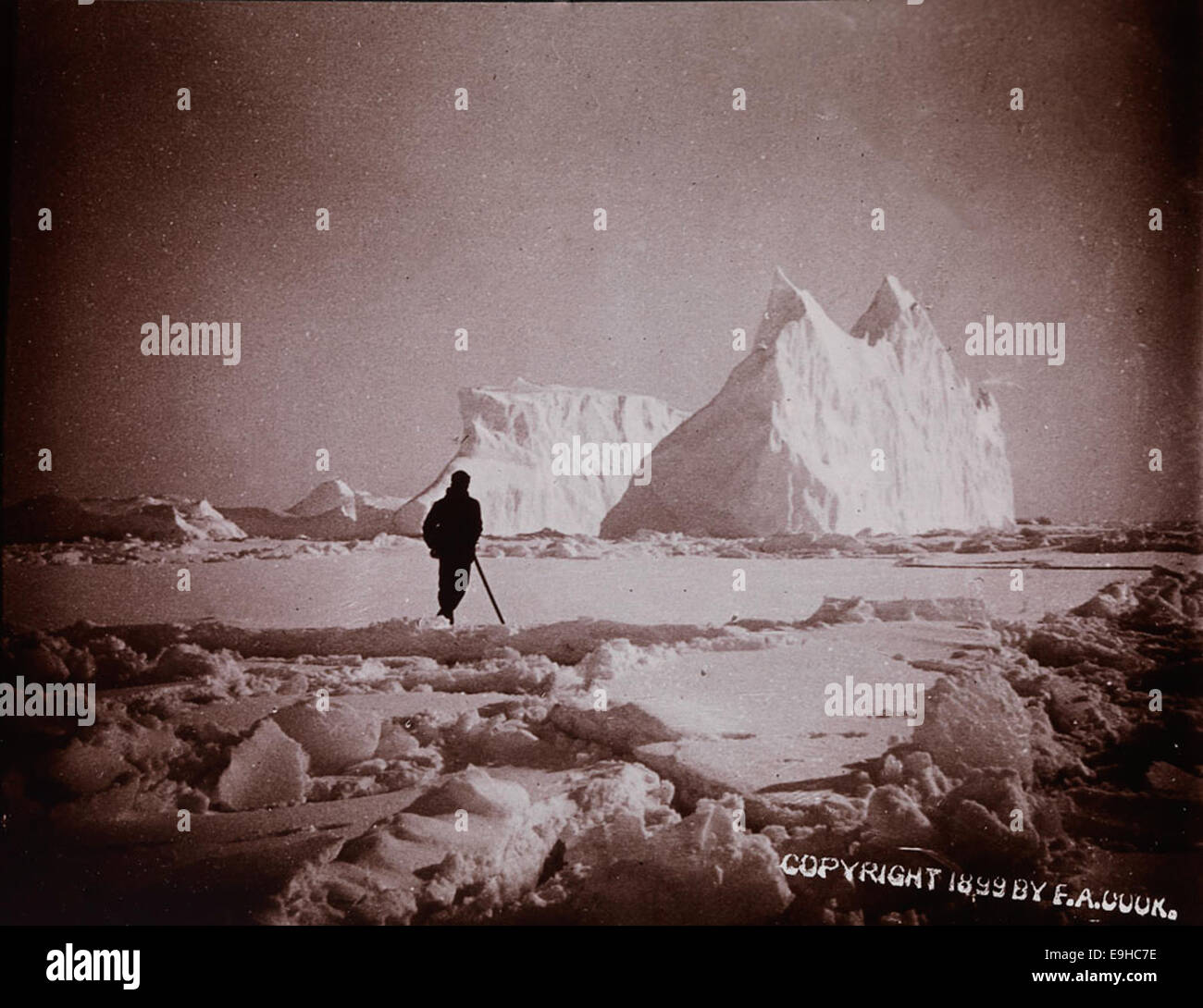 An unidentified person stands in an Antarctic landscape, part of the ...