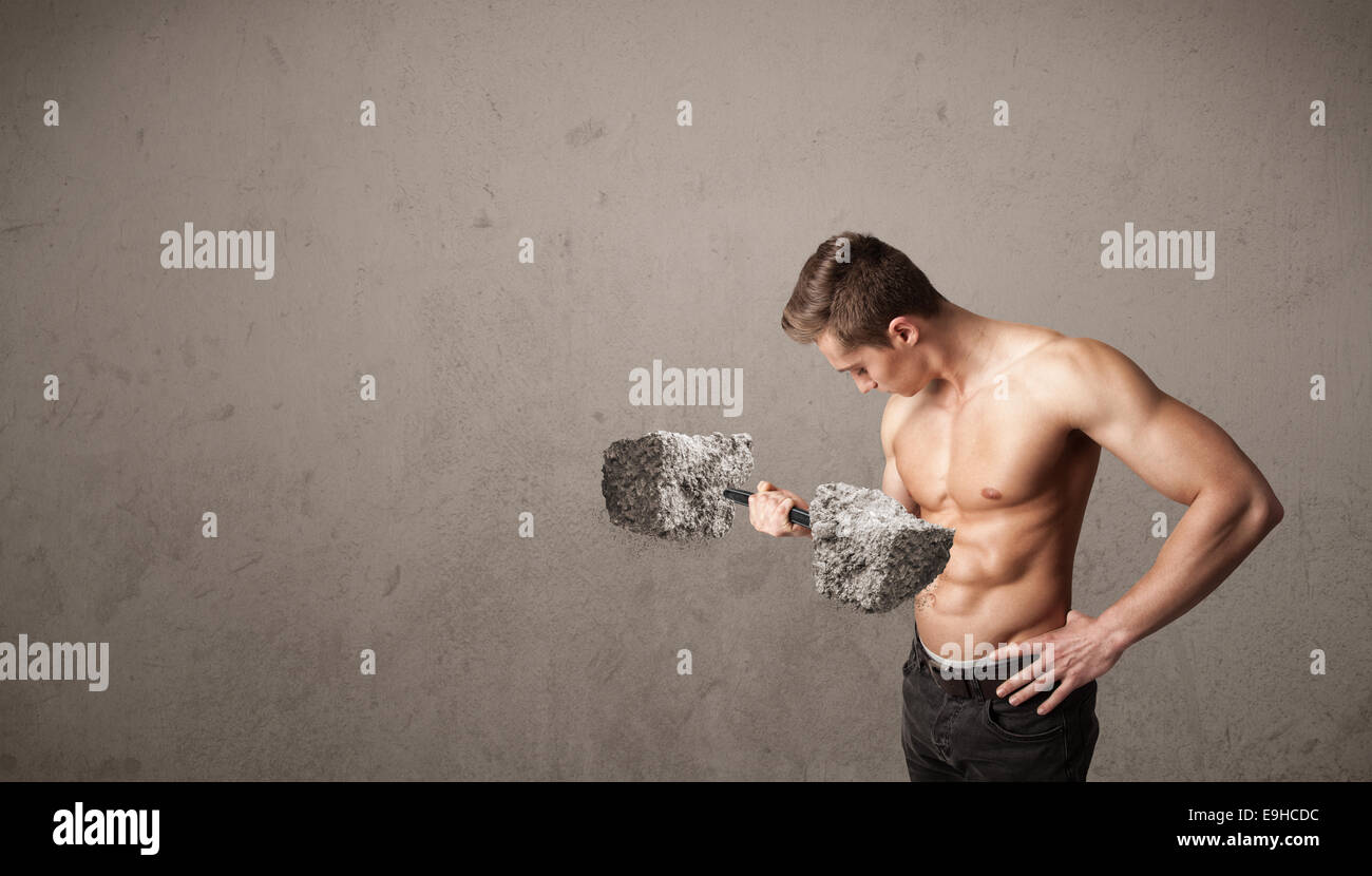 muscular man lifting large rock stone weights Stock Photo - Alamy