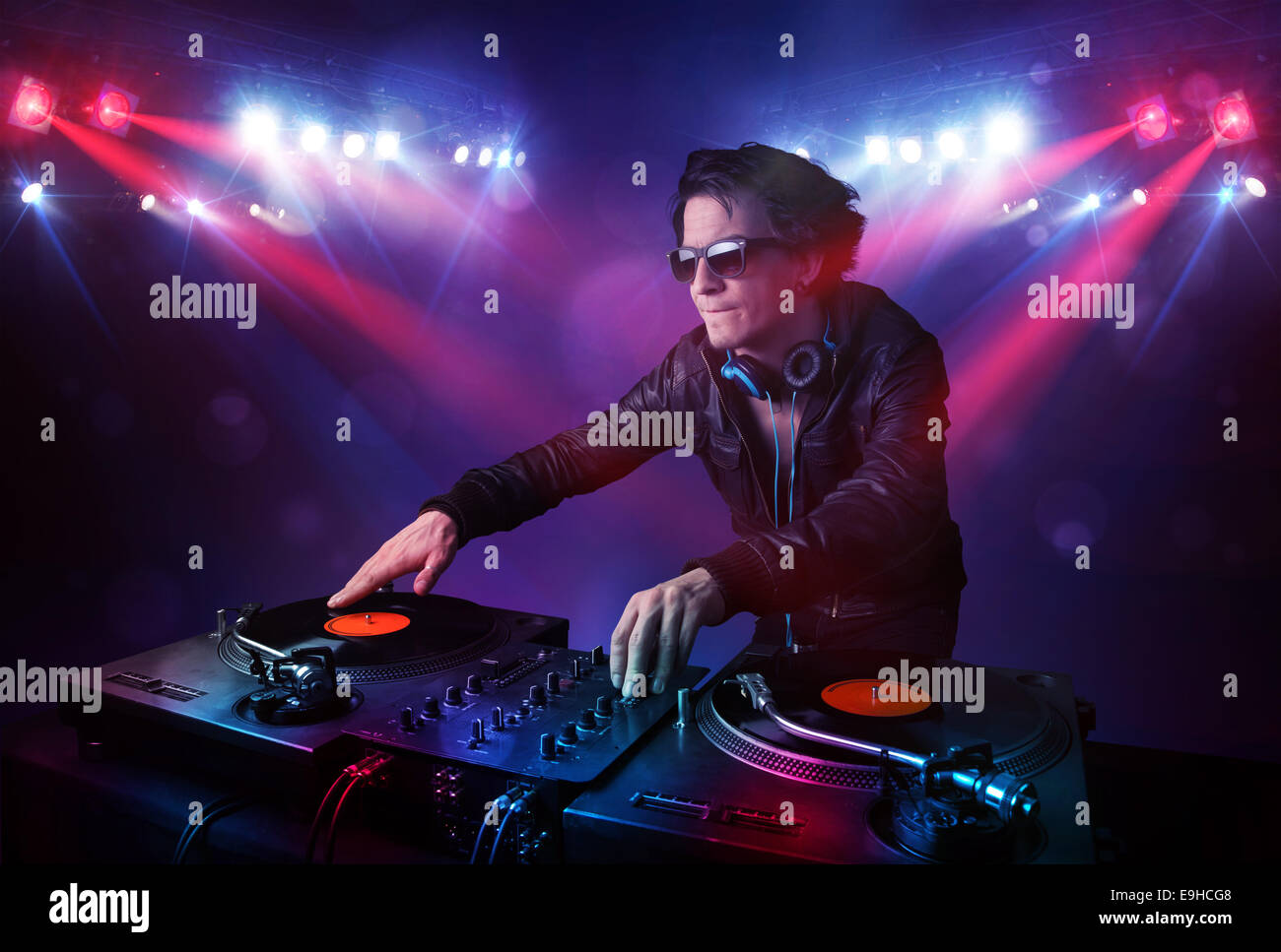 Teenager dj mixing records in front of a crowd on stage Stock Photo - Alamy