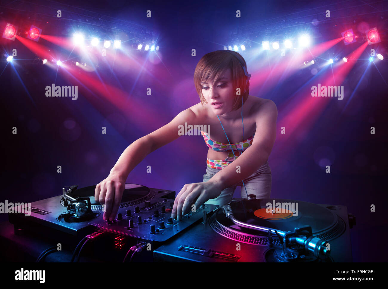 Teenager Dj mixing records in front of a crowd on stage Stock Photo - Alamy