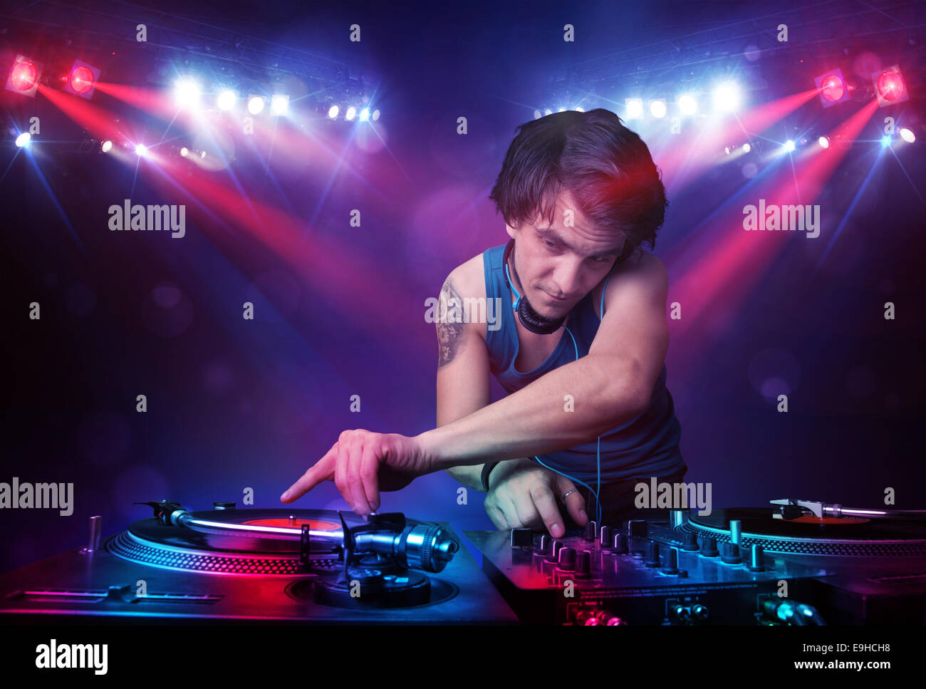 Teenager dj mixing records in front of a crowd on stage Stock Photo - Alamy