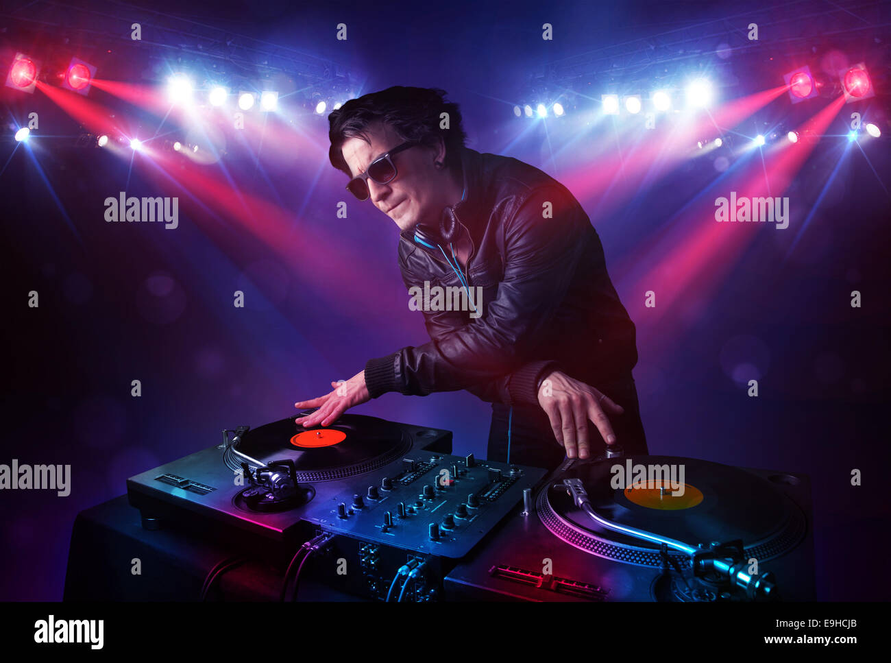 Teenager dj mixing records in front of a crowd on stage Stock Photo - Alamy
