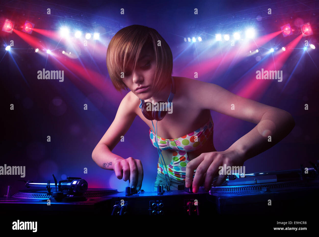 Teenager Dj mixing records in front of a crowd on stage Stock Photo - Alamy