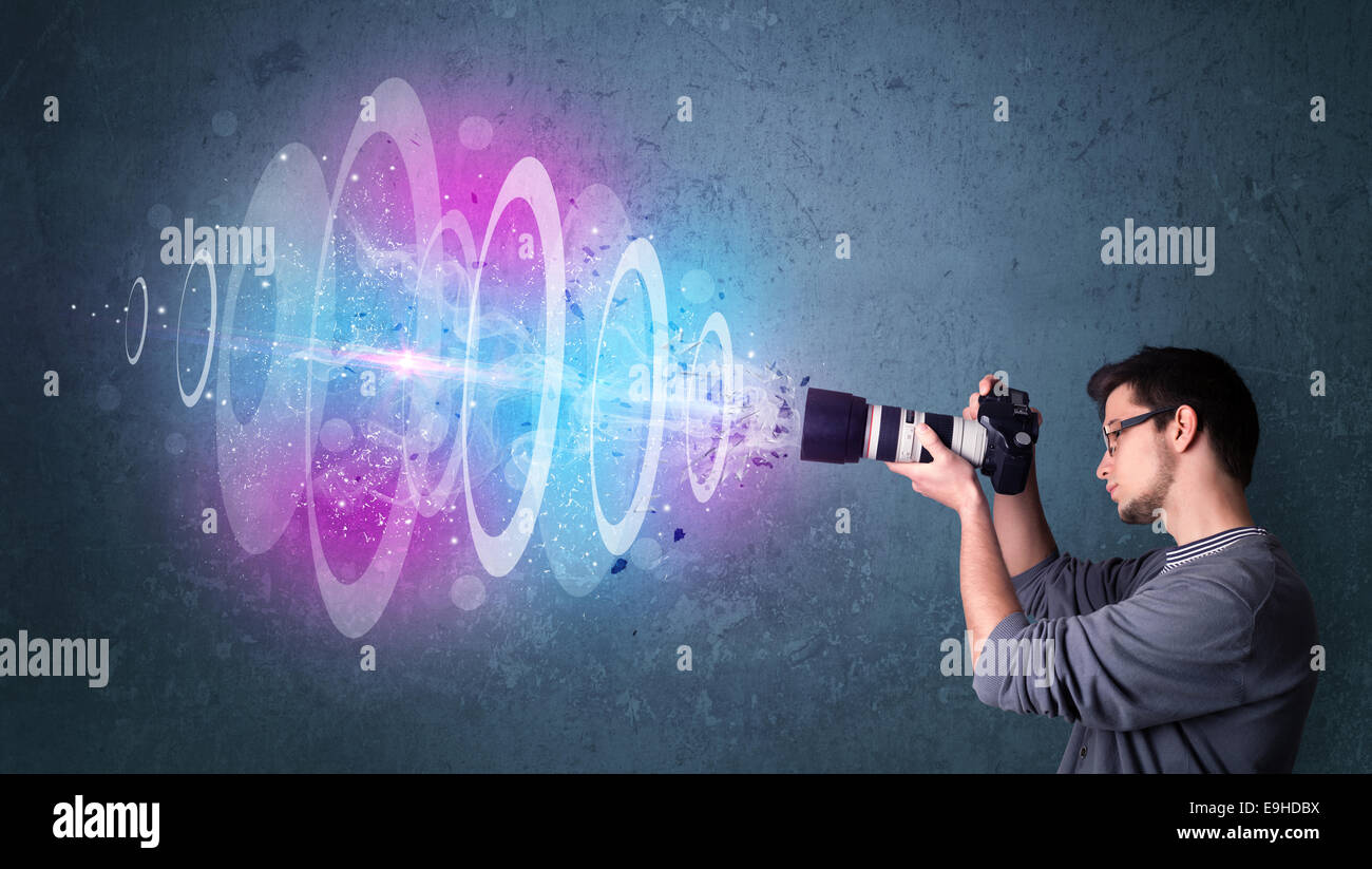 Photographer making photos with powerful light beam Stock Photo - Alamy