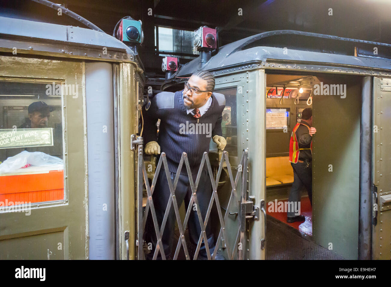 A conductor checks for door confirmation prior to departure on a ...