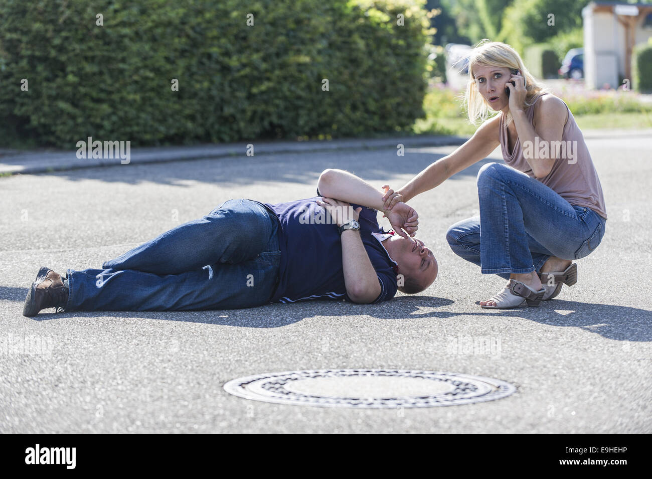 Man with heart attack receives first aid Stock Photo - Alamy