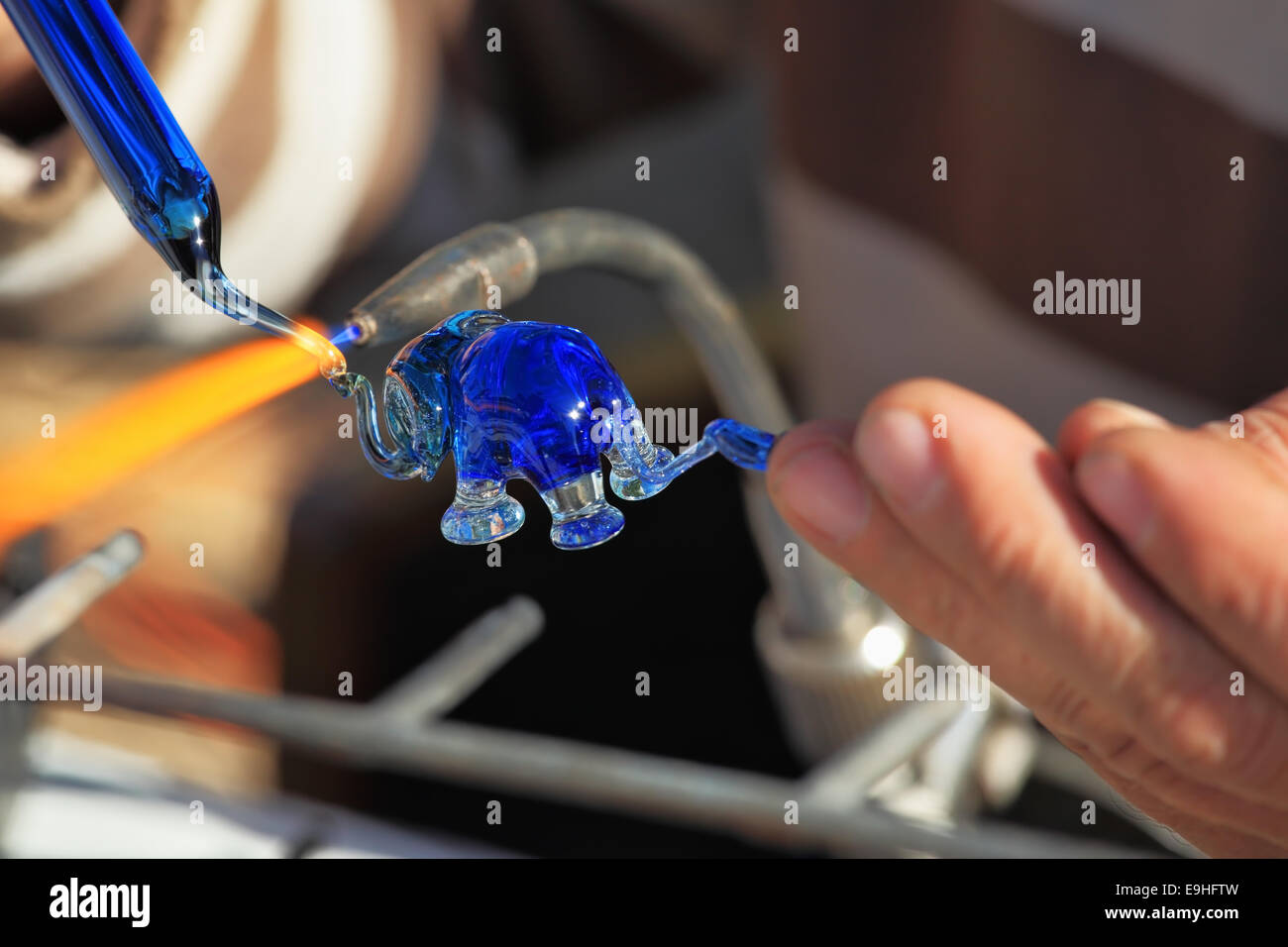 Delicate work of the glass blower Stock Photo - Alamy
