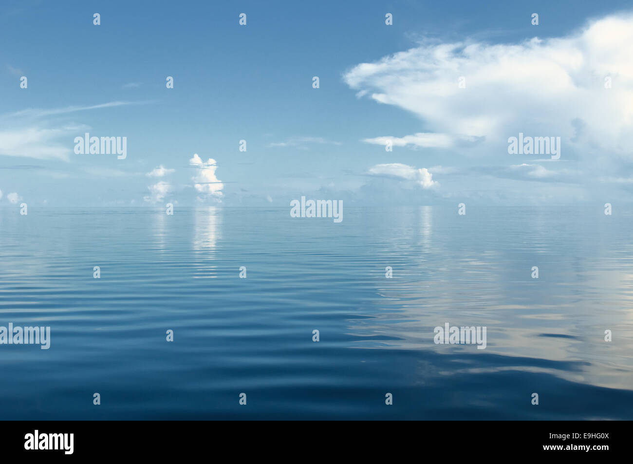 background of ocean and blue cloudy sky Stock Photo - Alamy