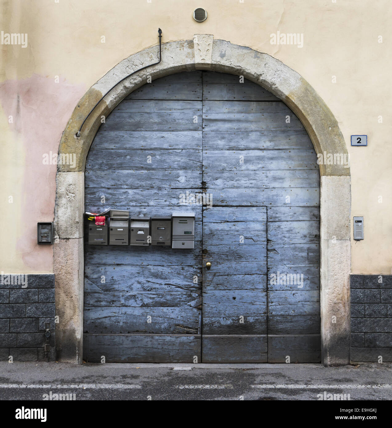 big gate with letter boxes Stock Photo - Alamy