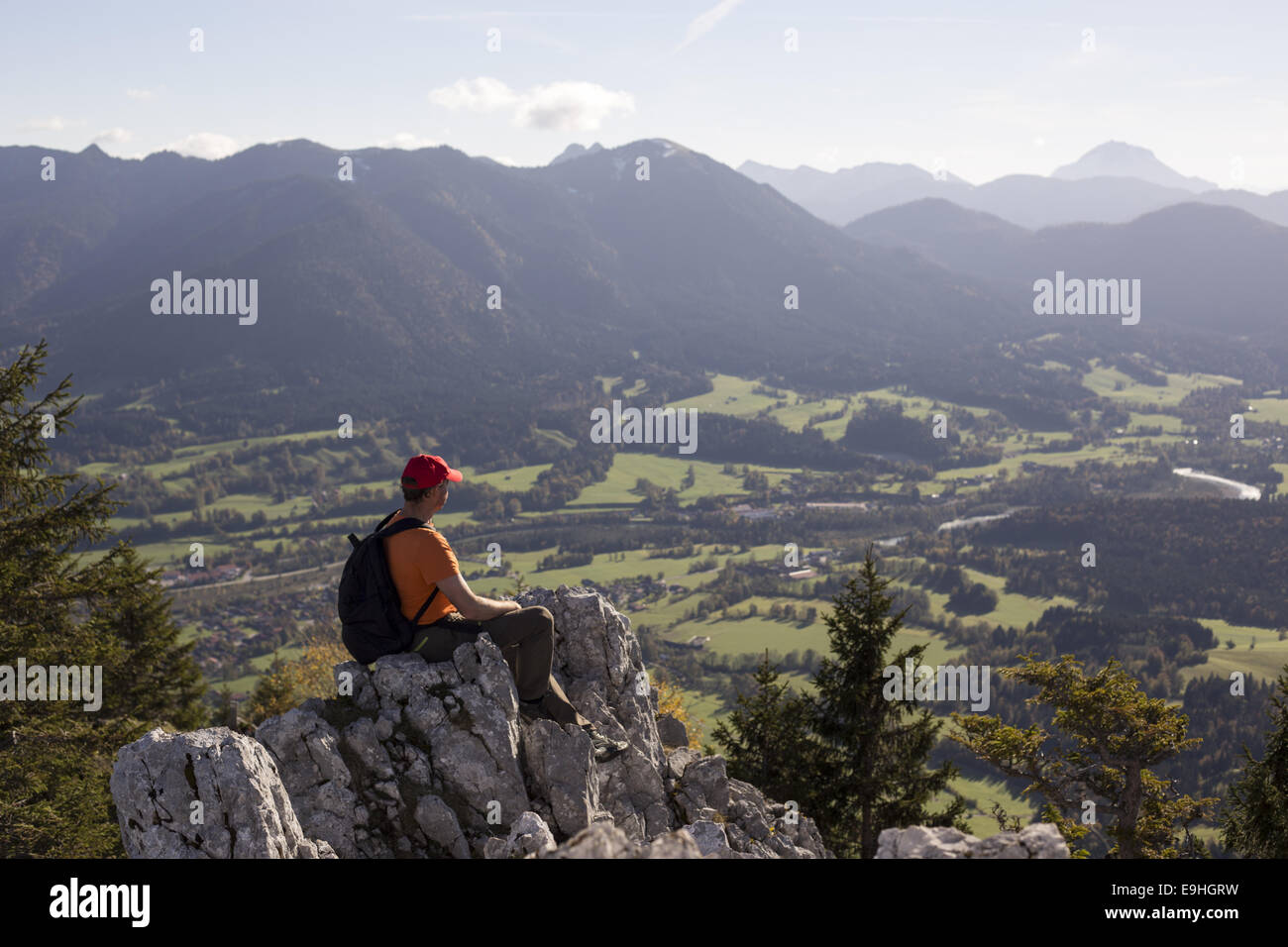 Man sitting on high rock hi-res stock photography and images - Alamy